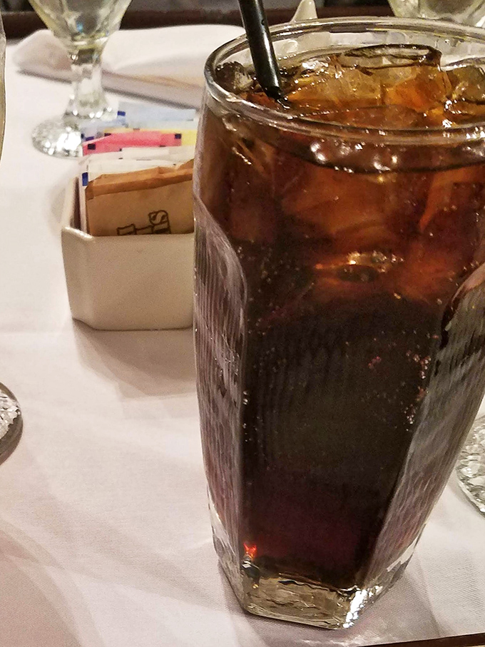 Even the cola gets the proper treatment here, served in a glass that makes every sip feel like you're starring in your own period drama.