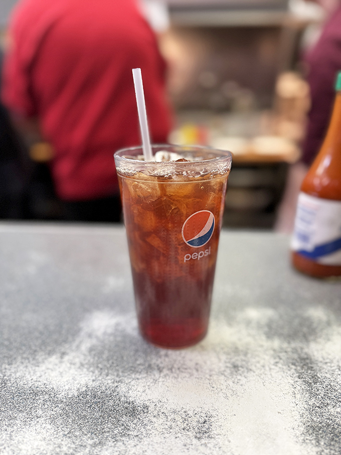 That first sip of fountain Pepsi hits differently when it's served in a place where nobody's ever uttered the word "artisanal."