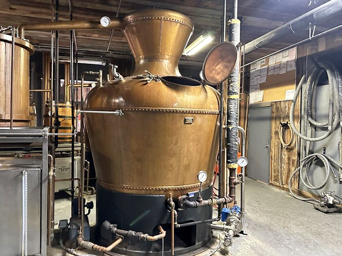 The beating copper heart of Ole Smoky! This gleaming still transforms simple corn mash into the clear, potent spirit that put Tennessee moonshiners on the map.