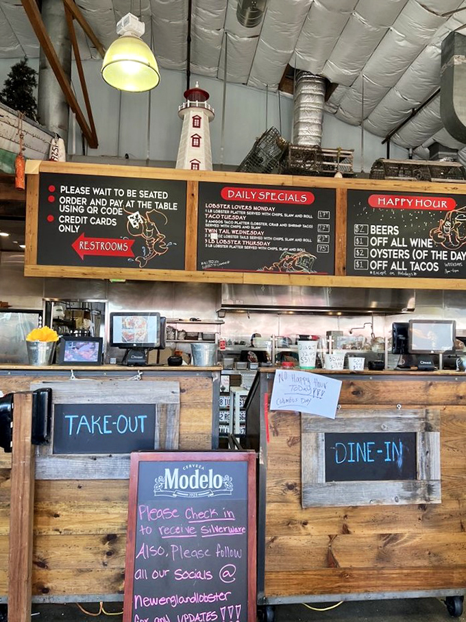 The ordering counter tells the whole story—casual vibes, serious seafood. That lighthouse decoration watches over the proceedings like a tasty guardian angel.