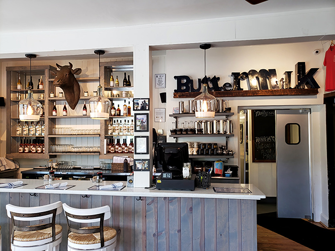 Behind the weathered wood counter, shelves lined with jars and bottles hint at the from-scratch philosophy that makes every bite here taste like a homecoming.