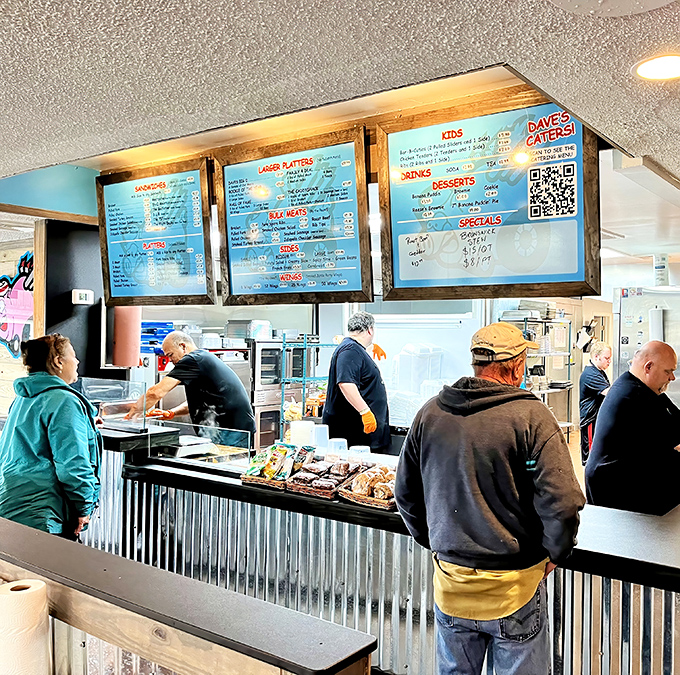 The menu boards loom above like sacred texts, promising smoky salvation to all who approach the counter.