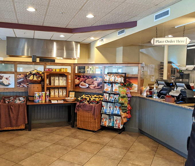 The ordering counter stands ready like the gates of heaven, promising carbohydrate nirvana to all who approach with hungry hearts.