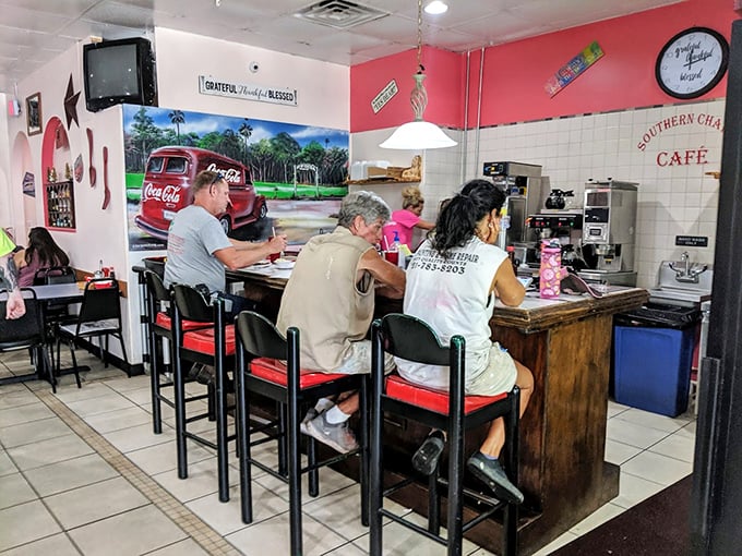Counter seating with a vintage Coca-Cola mural - Americana meets appetite in the most delightful way.