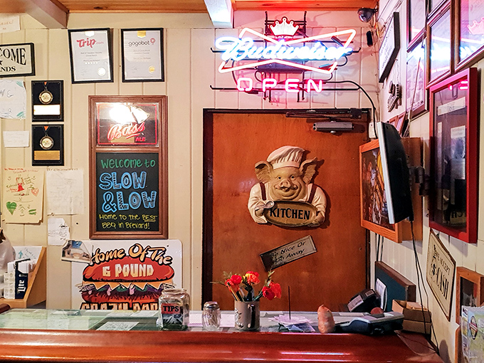 The wall of accolades and pig chef mascot tell you everything: this place takes barbecue seriously while keeping its sense of humor intact.