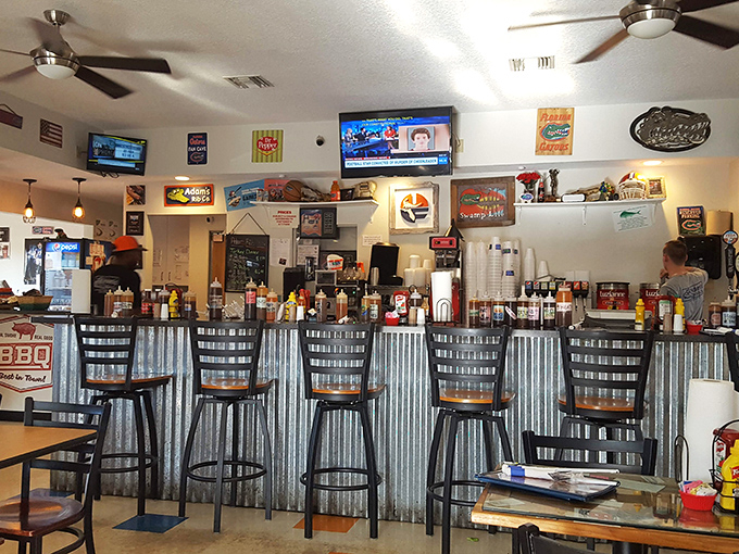 The counter where magic happens&mdash;corrugated metal meets barbecue science in a space that's both functional and inviting.