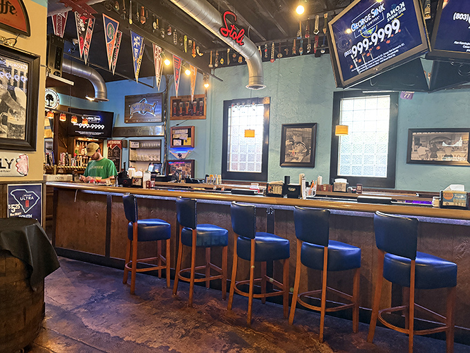 The bar's warm wood tones and sports pennants create that perfect "neighborhood joint" vibe where everybody feels like a regular.