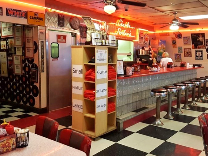 The counter view reveals the classic diner setup where regulars claim their territory and waitresses remember your order before you've fully settled onto your stool.
