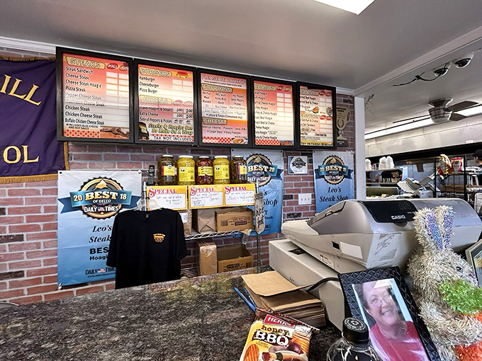 The menu board &ndash; a roadmap to satisfaction. Award badges proudly displayed like medals on a general's chest, earned through sandwich excellence.