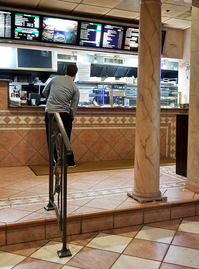 The counter where pizza dreams begin their journey from raw ingredients to the masterpiece that will soon grace your table. 