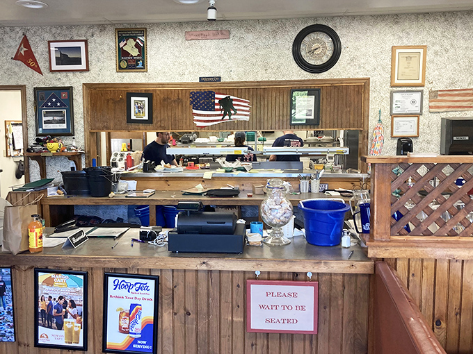 The heart of operations, where seafood dreams are born and the "Please Wait to be Seated" sign is the last hurdle before crab paradise.