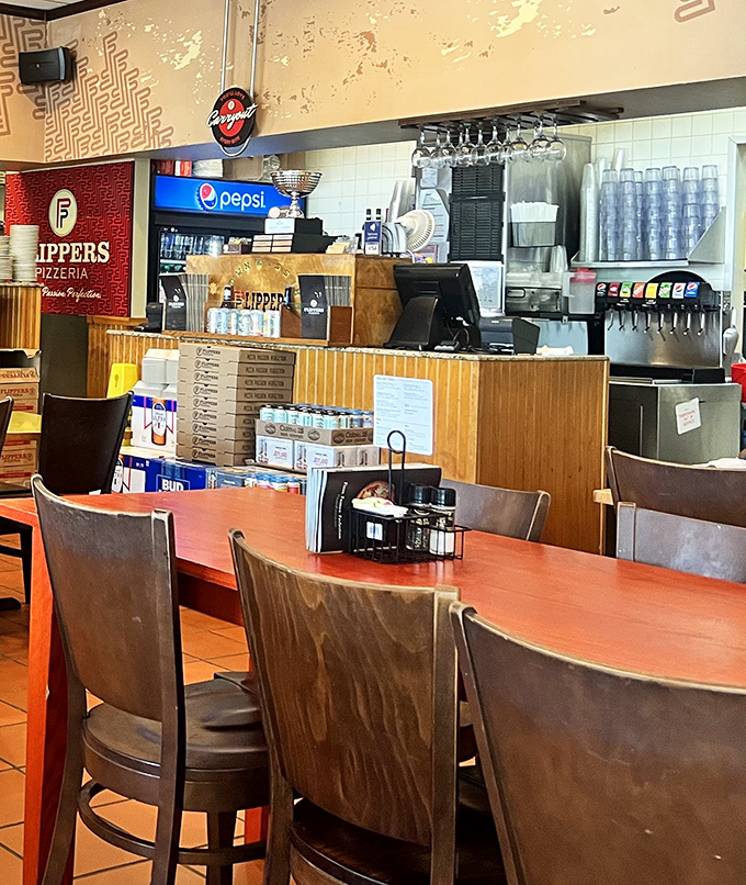 The counter where pizza dreams come true&mdash;stacked with boxes ready to transform ordinary evenings into impromptu celebrations.