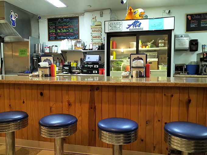 The counter at Al's&mdash;where regulars become family and first-timers become regulars. Those blue stools have supported generations of Green Bay residents seeking comfort food and conversation.