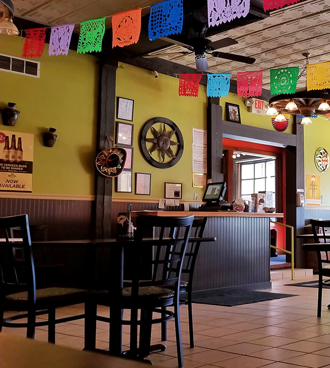 The colorful papel picado and warm yellow walls create the feeling you've been invited to the best house party in town.