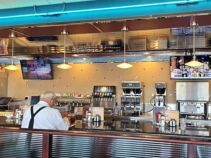 Behind the counter, where breakfast dreams are born and coffee cups never stay empty for long. Diner magic happens here.