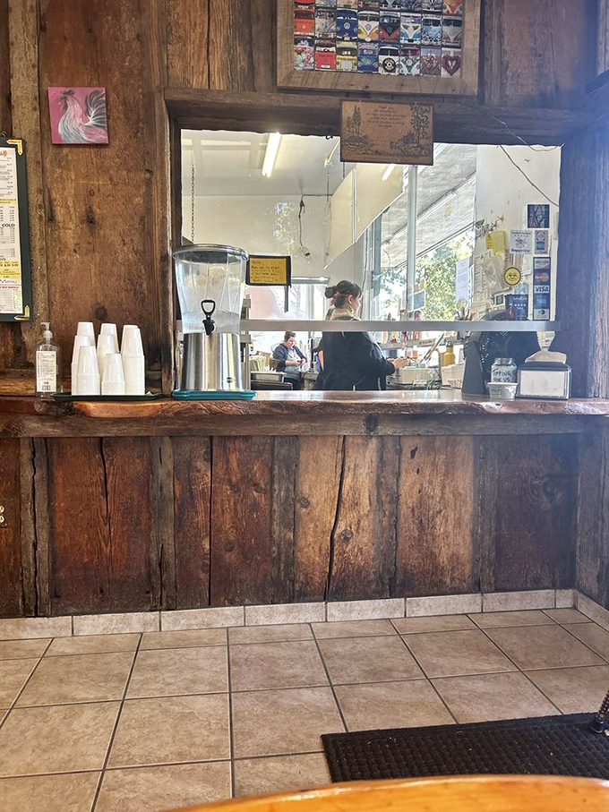 Behind this wooden counter, culinary magic happens with zero pretension. Coffee urns stand ready for caffeine emergencies of any magnitude.