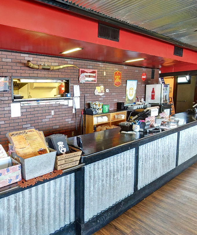Behind this counter, dedicated staff orchestrate the barbecue symphony that keeps customers coming back for more helpings.