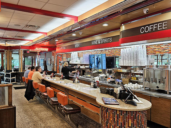 The counter: where solo diners find community, coffee achieves immortality through infinite refills, and life's problems seem temporarily solvable.