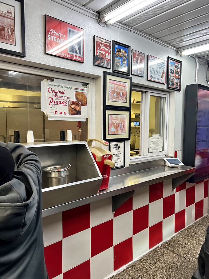 Red and white checkerboard patterns create the visual signature that's become synonymous with Philip's straightforward sandwich excellence.