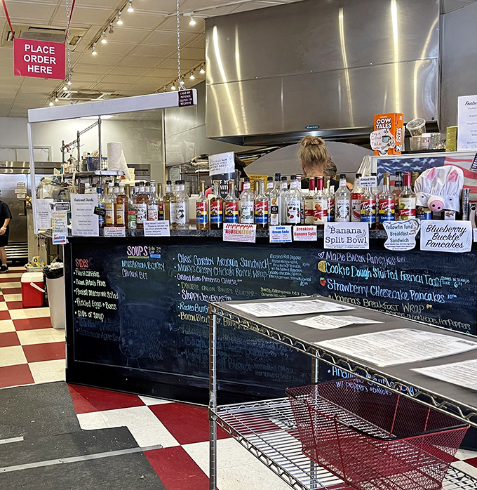 Behind this counter, breakfast magic happens. The chalkboard menu promises everything from banana splits to stuffed French toast&mdash;all reasons to extend your visit.