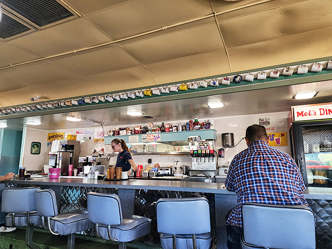 At this counter, coffee cups are never empty, stories are never boring, and the view of the kitchen is better than any five-star restaurant's open concept.