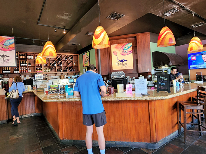 The counter where coffee dreams come true and breakfast orders are dispatched with military precision and civilian friendliness.