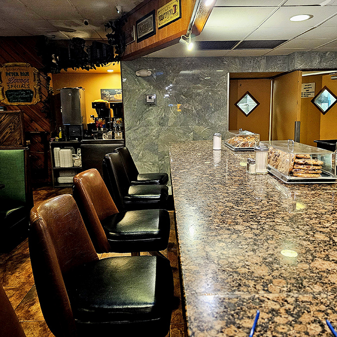 The counter where magic happens. Those stools have witnessed first dates, business deals, and countless "just one more coffee" moments.