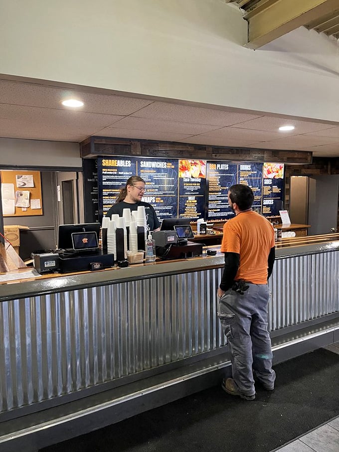 The ordering counter&mdash;that magical threshold where dreams of smoked meat become reality. Notice the corrugated metal? Classic barbecue joint aesthetic.
