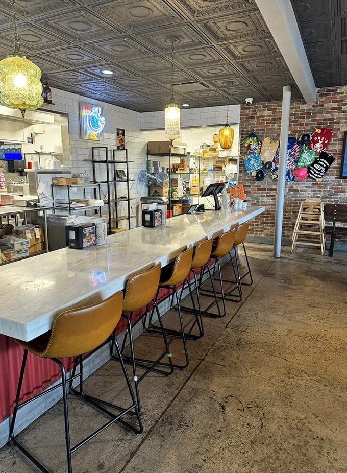 Clean lines, warm lighting, and comfortable seating at the counter—because great chicken deserves a proper stage for its performance.