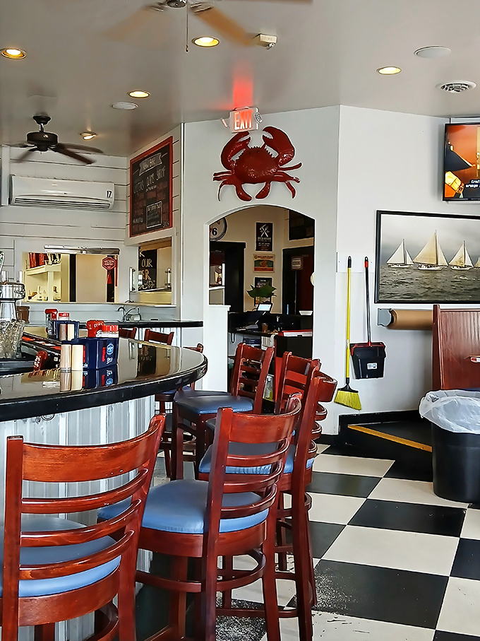 A giant red crab watches over patrons from its perch. The unofficial mascot seems to say, "You're going to need more napkins."
