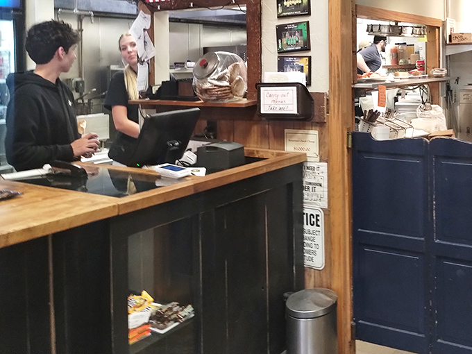 The counter where magic happens&mdash;young staff efficiently orchestrating the breakfast-to-dinner symphony that keeps Waynesville well-fed and happy.