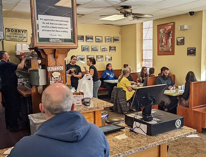 The bustling heart of breakfast operations. Notice the wall of accolades &ndash; they're not just decorating, they're documenting greatness.