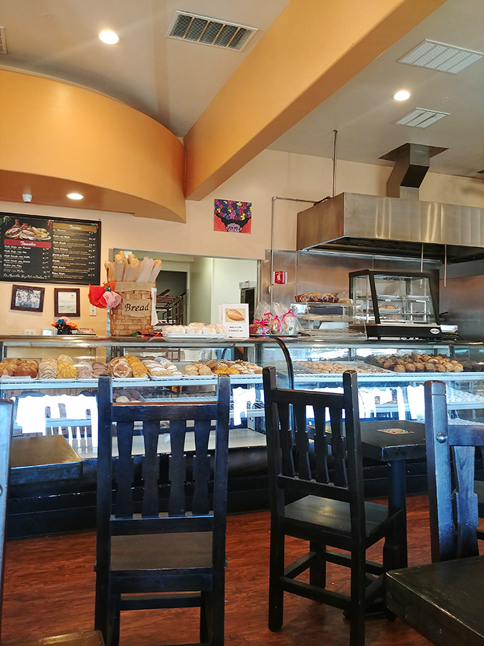 High ceilings and well-organized display cases create an airy, inviting space where decisions about which pastry to choose become delightfully overwhelming.