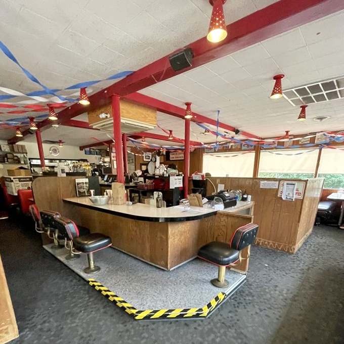 The counter seating offers front-row tickets to the burger ballet, where short-order choreography has been perfected over generations.