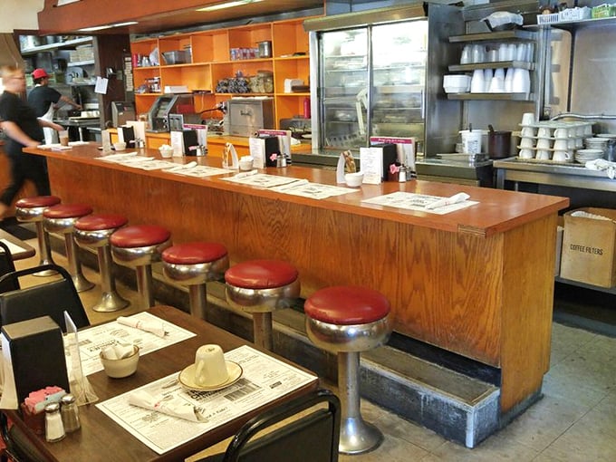 The diner's heart – a counter where regulars become family and first-timers quickly understand why this place has stood the test of time.