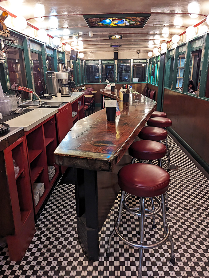 The counter&mdash;where solo diners find community, watching short-order ballet while perched on red vinyl thrones along the checkered floor runway.
