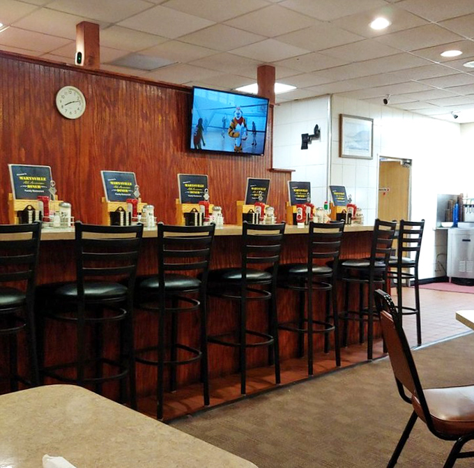 Counter seats: front-row tickets to the breakfast theater where the griddle is the stage and bacon is the star.