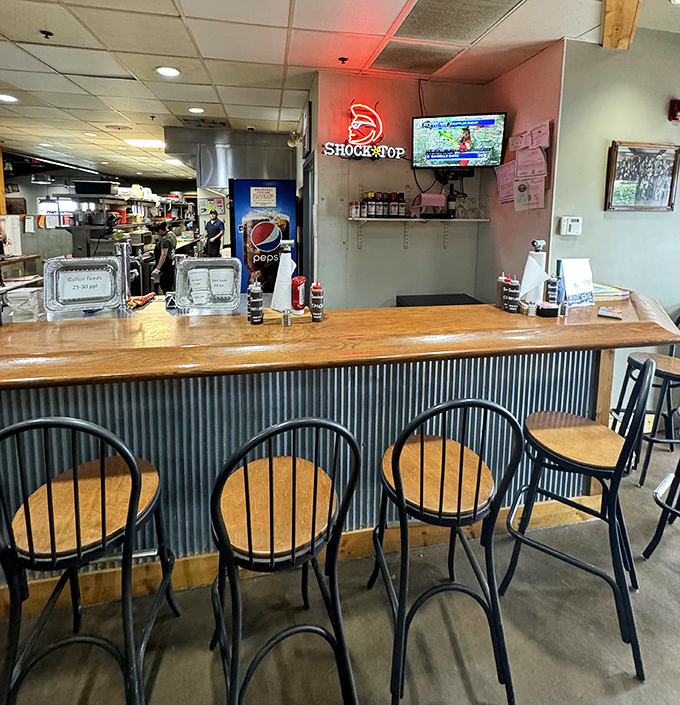 The corrugated metal bar says "we're serious about our rustic vibe" while those comfortable stools invite you to stay awhile.