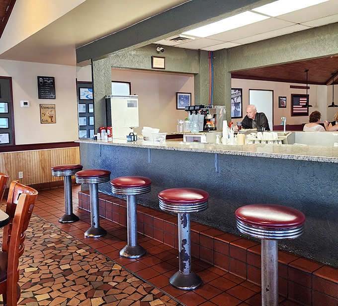 Classic counter seating where solo diners become regulars and regulars become part of the restaurant's living history.