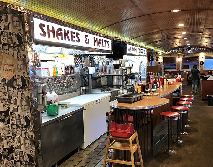 The "Shakes & Malts" counter promises frozen delights that require serious straw-wrestling skills and possibly a moment of silence before consumption.