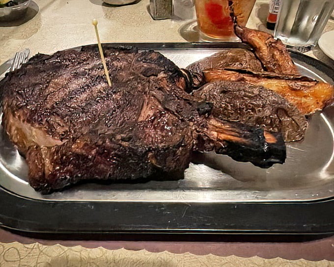 The Cowboy Ribeye isn't just a steak—it's a statement piece, a conversation stopper, and possibly the reason cameras were invented.