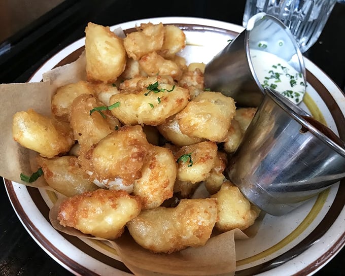 Cheese curds that squeak with personality. Crispy, golden nuggets of Wisconsin's finest, elevated by a dipping sauce worth fighting over.
