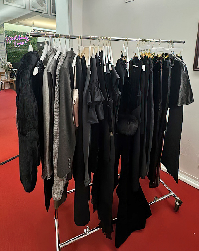 The designer rack showcases a collection of black garments that would make New Yorkers nod in approval. Timeless pieces waiting for their Florida renaissance.