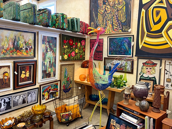 Art stacked three-deep against walls, sculptures perched like exotic birds&mdash;this booth feels like the storage room of a small eccentric museum.