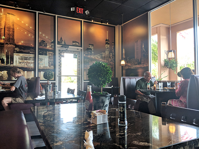 New York skyline murals transport you north while you dine in the Sunshine State. The black marble tables reflect more than just the lighting.