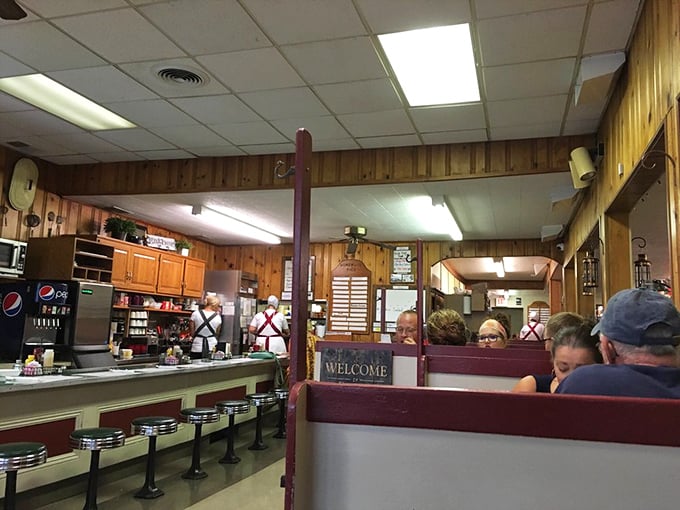 Where booths become confessionals and strangers become neighbors. The dining room hums with the soundtrack of community.