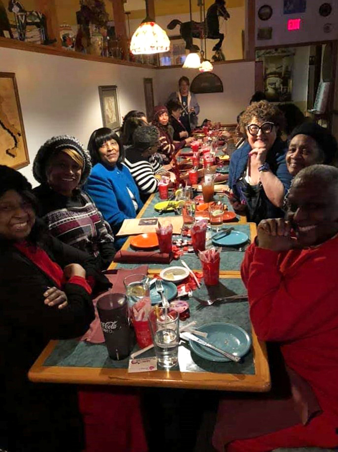The true measure of a great restaurant: happy faces around a table. These diners look like they've just discovered the secret to eternal happiness.