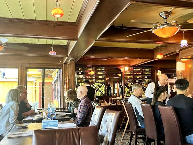 Diners bask in warm wood-paneled ambiance as attentive servers navigate between tables&mdash;the kind of place where conversations flow as smoothly as the wine.