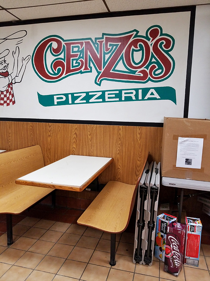 The Cenzo's logo watches over diners like a guardian angel of good eating. No fancy frills, just the promise of satisfaction.
