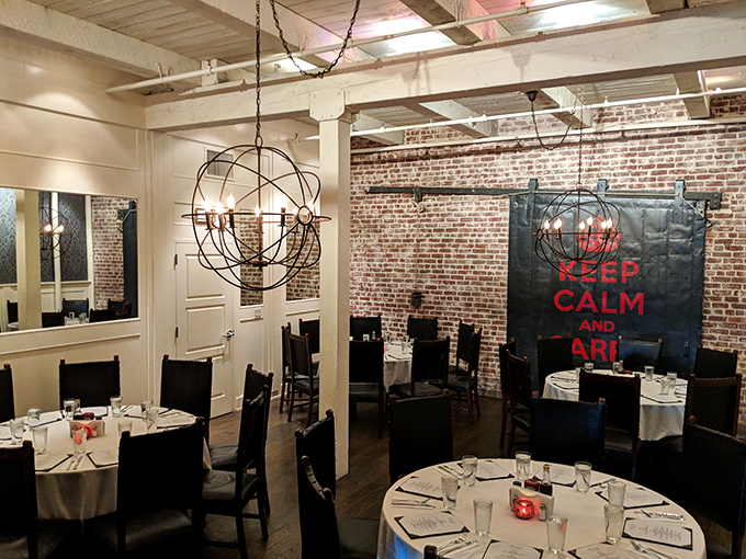 The "Keep Calm and Carry On" banner watches over diners like a British guardian angel ensuring proper enjoyment of puddings and pies.